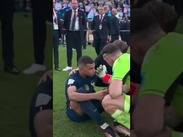 France's President Emmanuel Macron walks to Kylian Mbappé to console ...